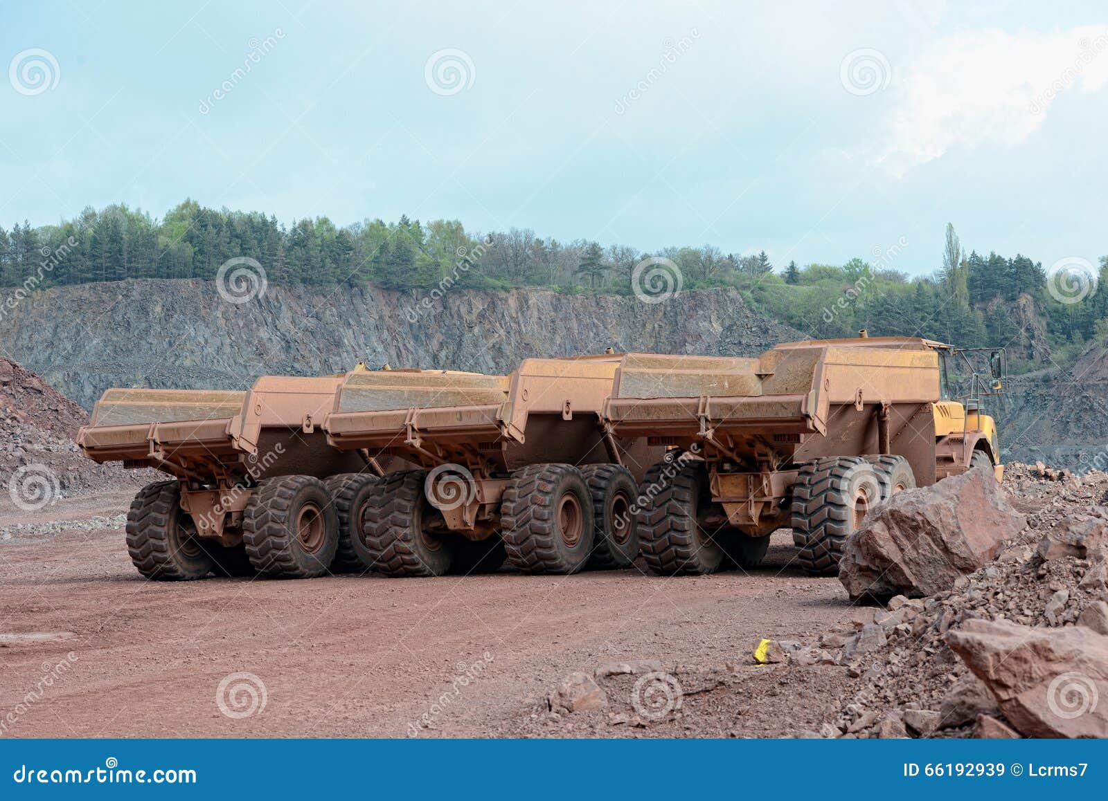 Three Dumper Trucks in a Row in a Quarry Mine. Stock Image - Image of ...