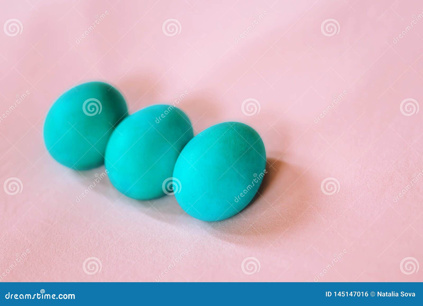 Three Easter Eggs of Turquoise Color on a Soft Pink Background. Stock ...