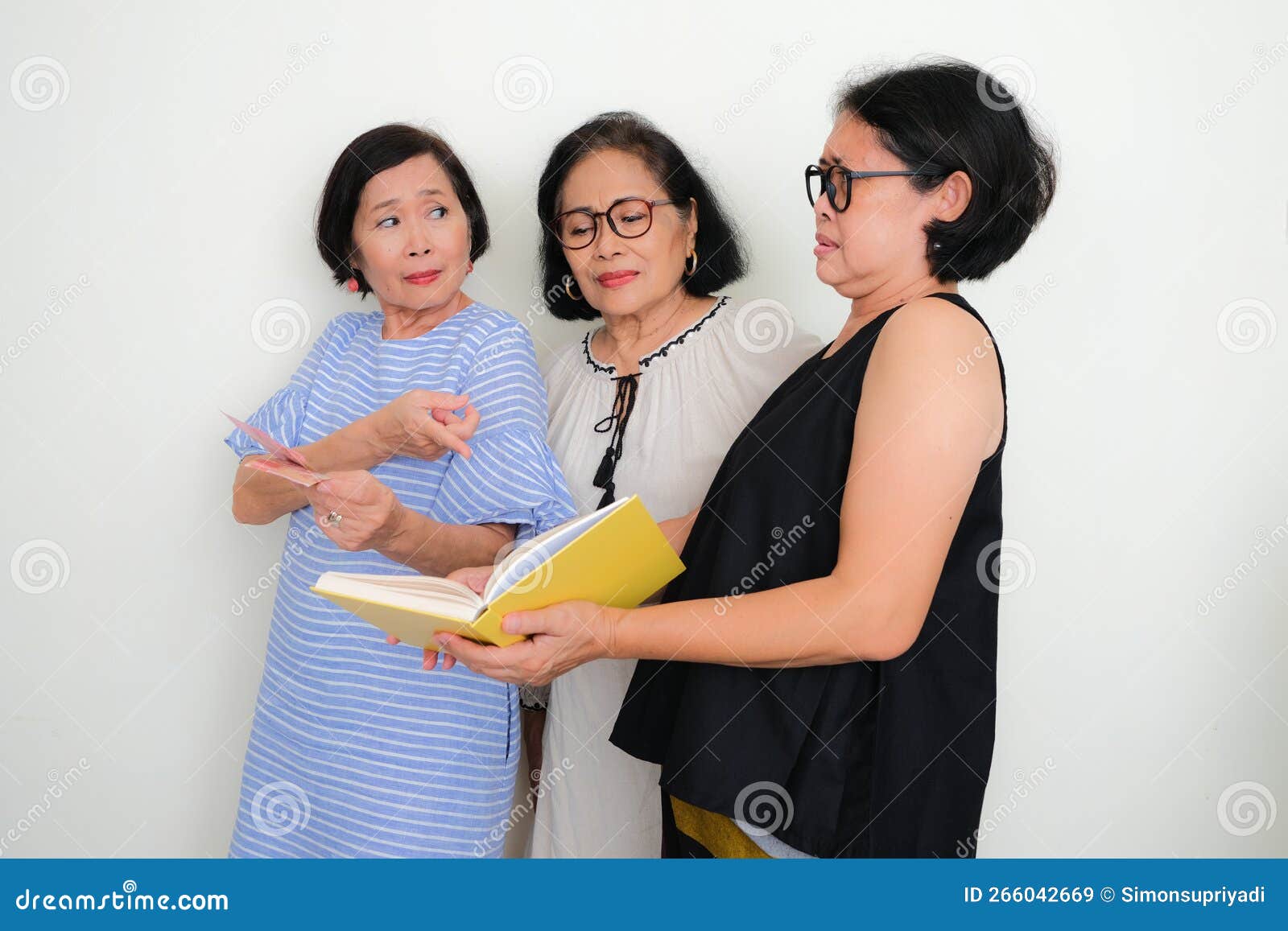 Three Elderly Women Standing Together and Reading Their Old Diary Stock ...