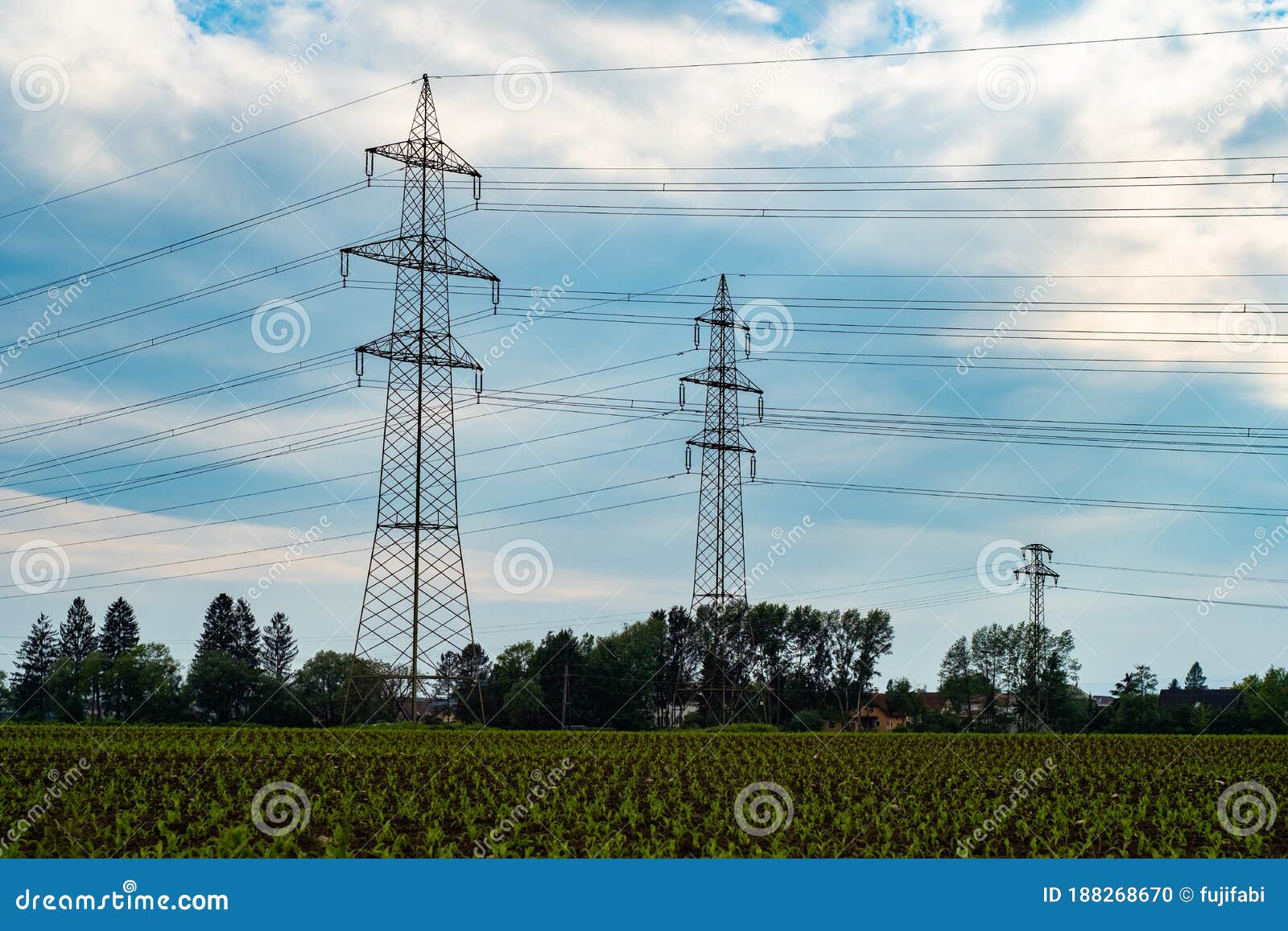 Three Electrical Tower and an Agricultural Field Stock Photo - Image of ...