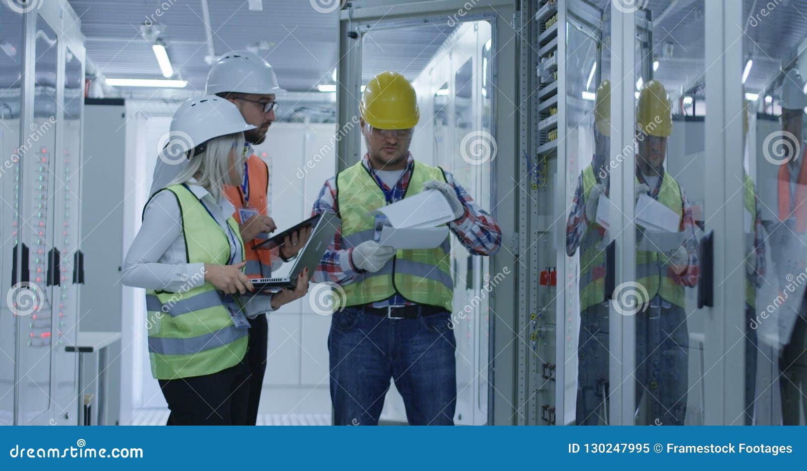 Three Electrical Workers Reviewing Documents Stock Video - Video of ...