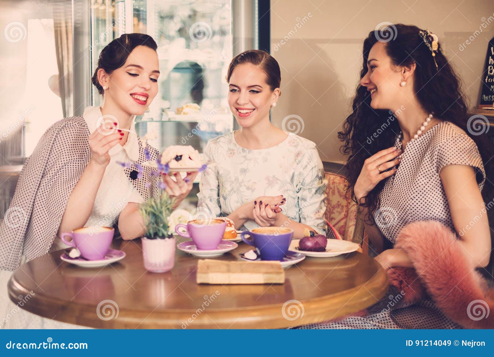 Three Elegant Young Ladies in a Cafe Stock Image - Image of eatery ...