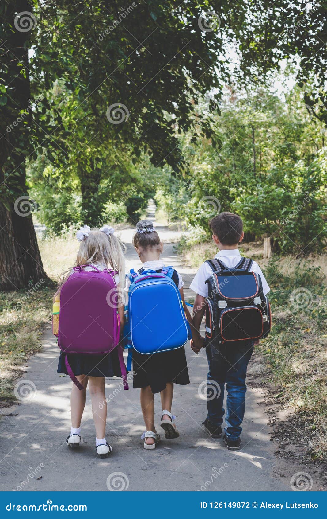 Three Elementary School Students with Backpacks Stock Photo - Image of ...