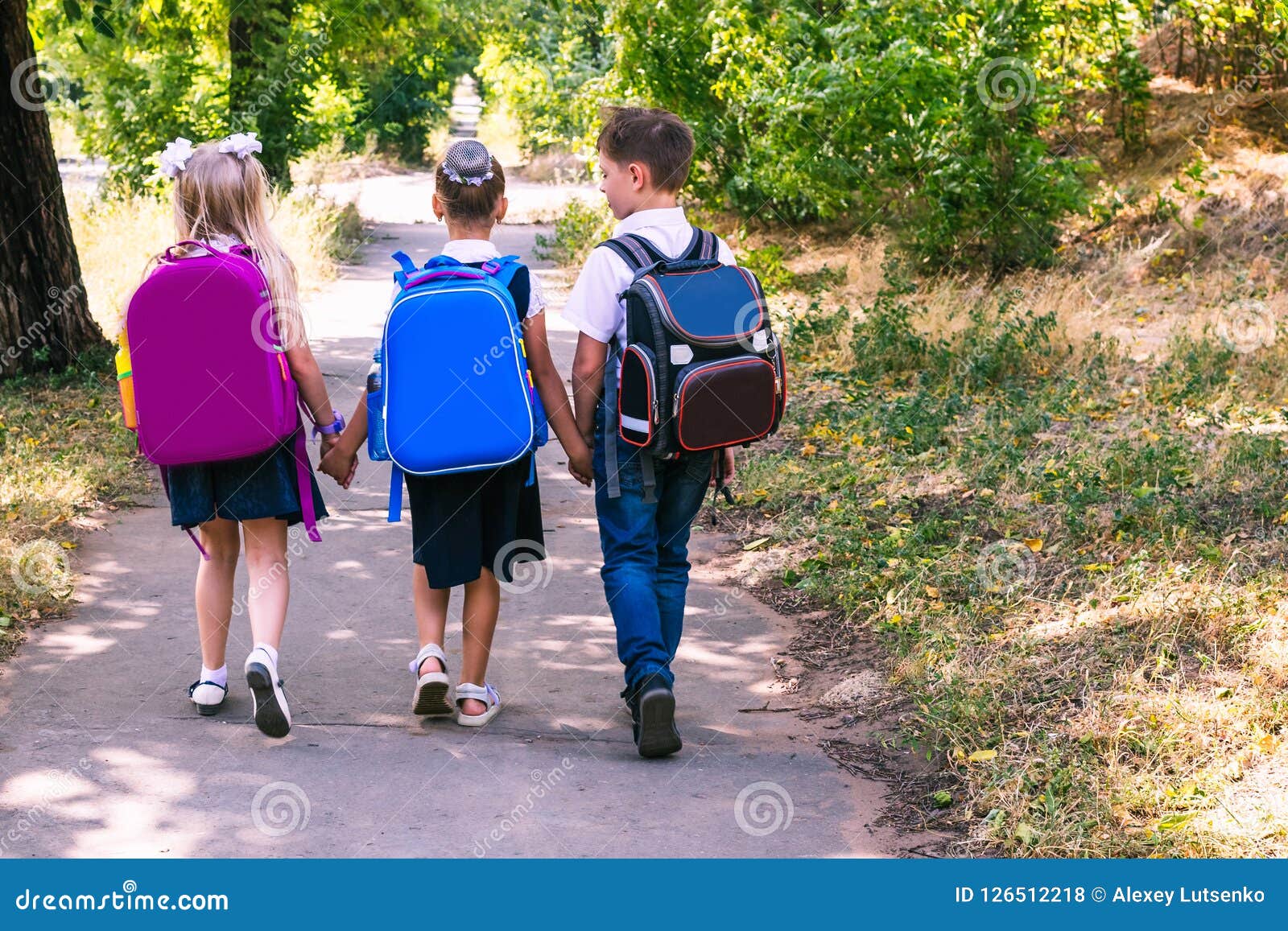 Three Elementary School Students with Backpacks Stock Photo - Image of ...