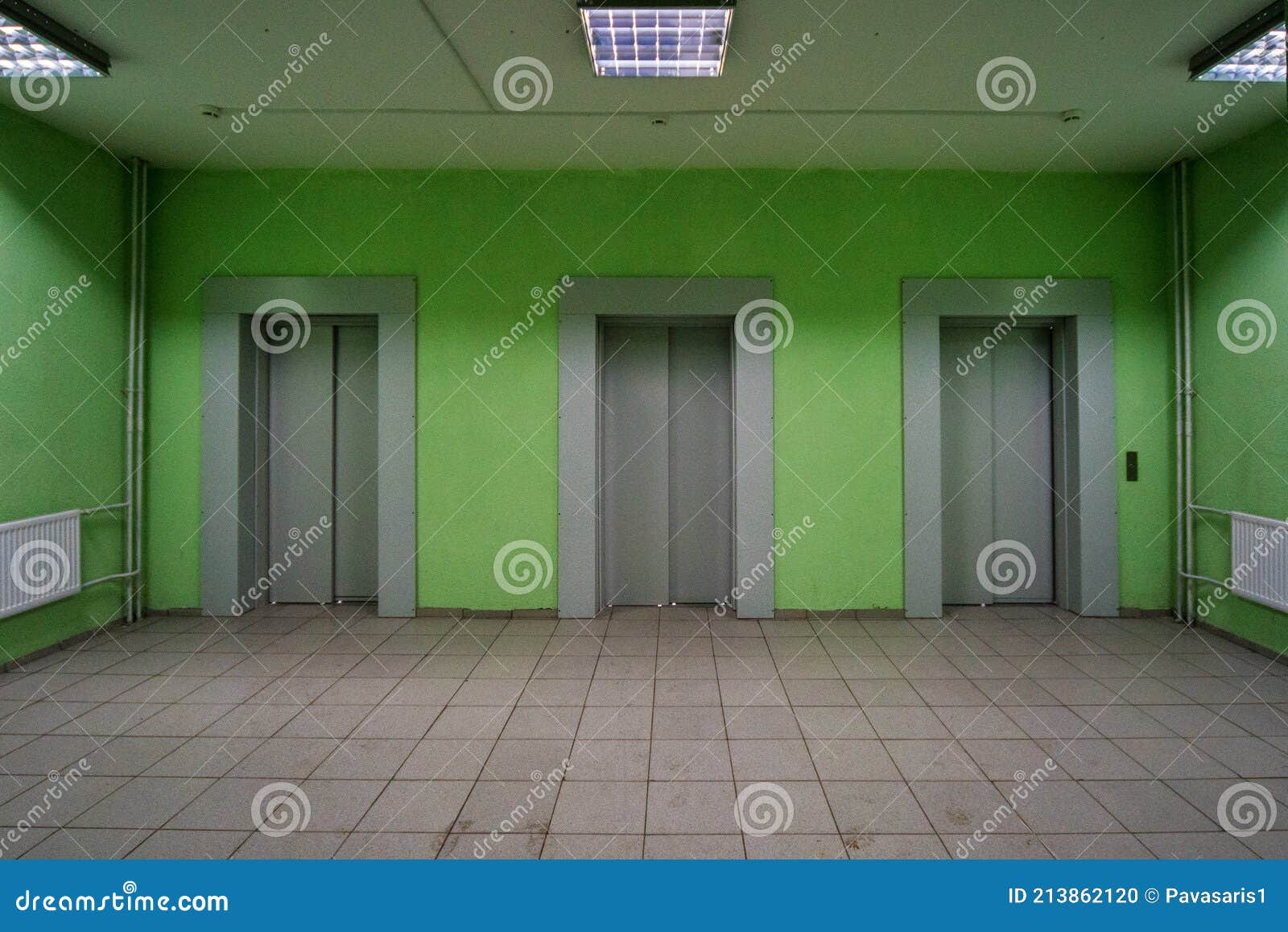 Three Elevator Doors in a Residential Building. Wide-angle View of ...