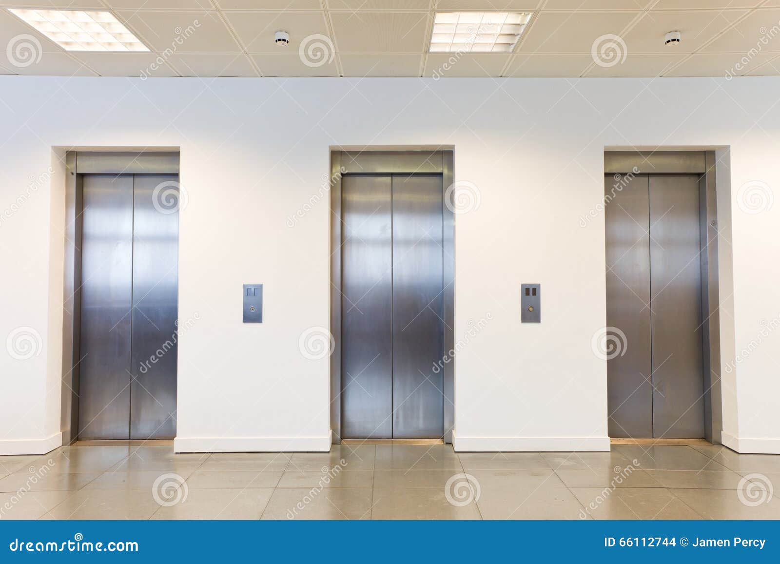 Three Elevators in Office Building Stock Photo - Image of access, metal ...