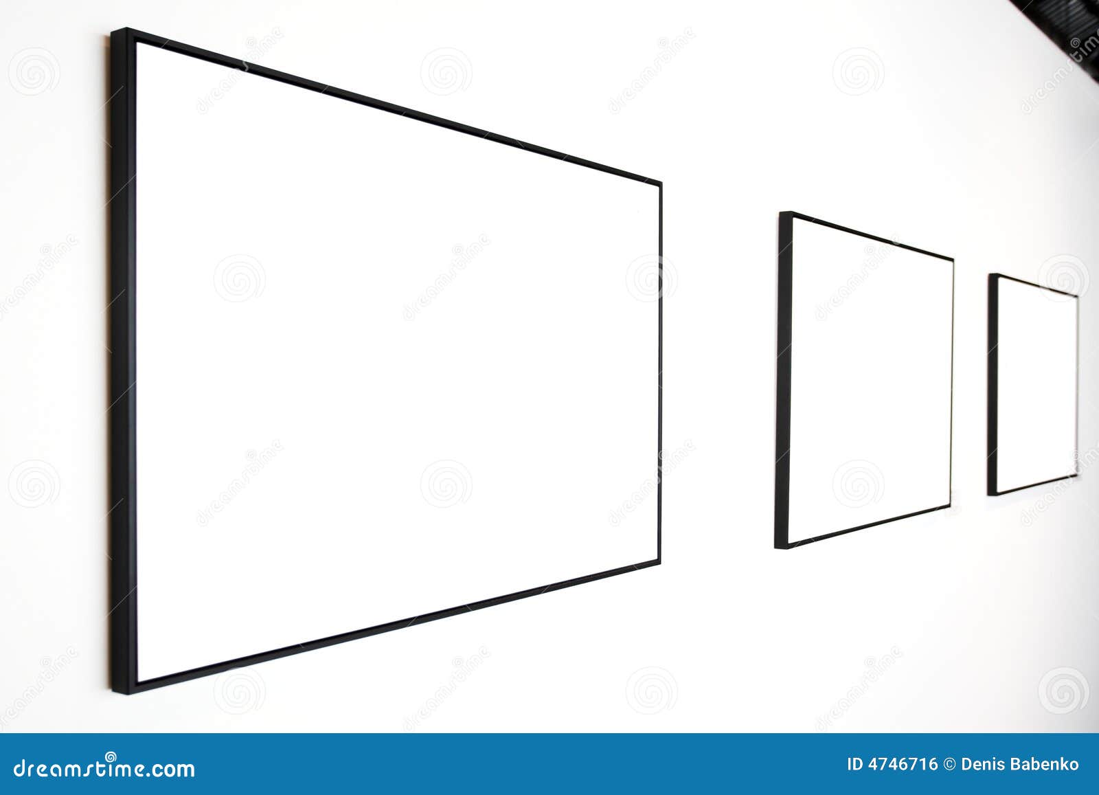 Three Empty Frames on White Wall Stock Photo - Image of advertising ...