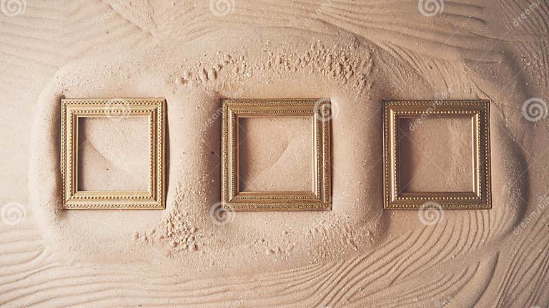 Three Empty Ornate Gold Frames Arranged on Textured Beige Sand ...