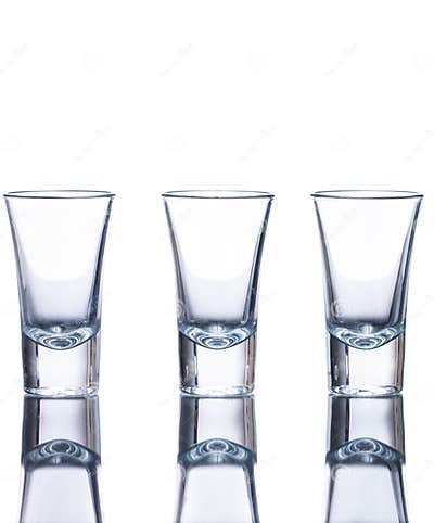 Three empty shot glasses stock image. Image of booze - 25531607