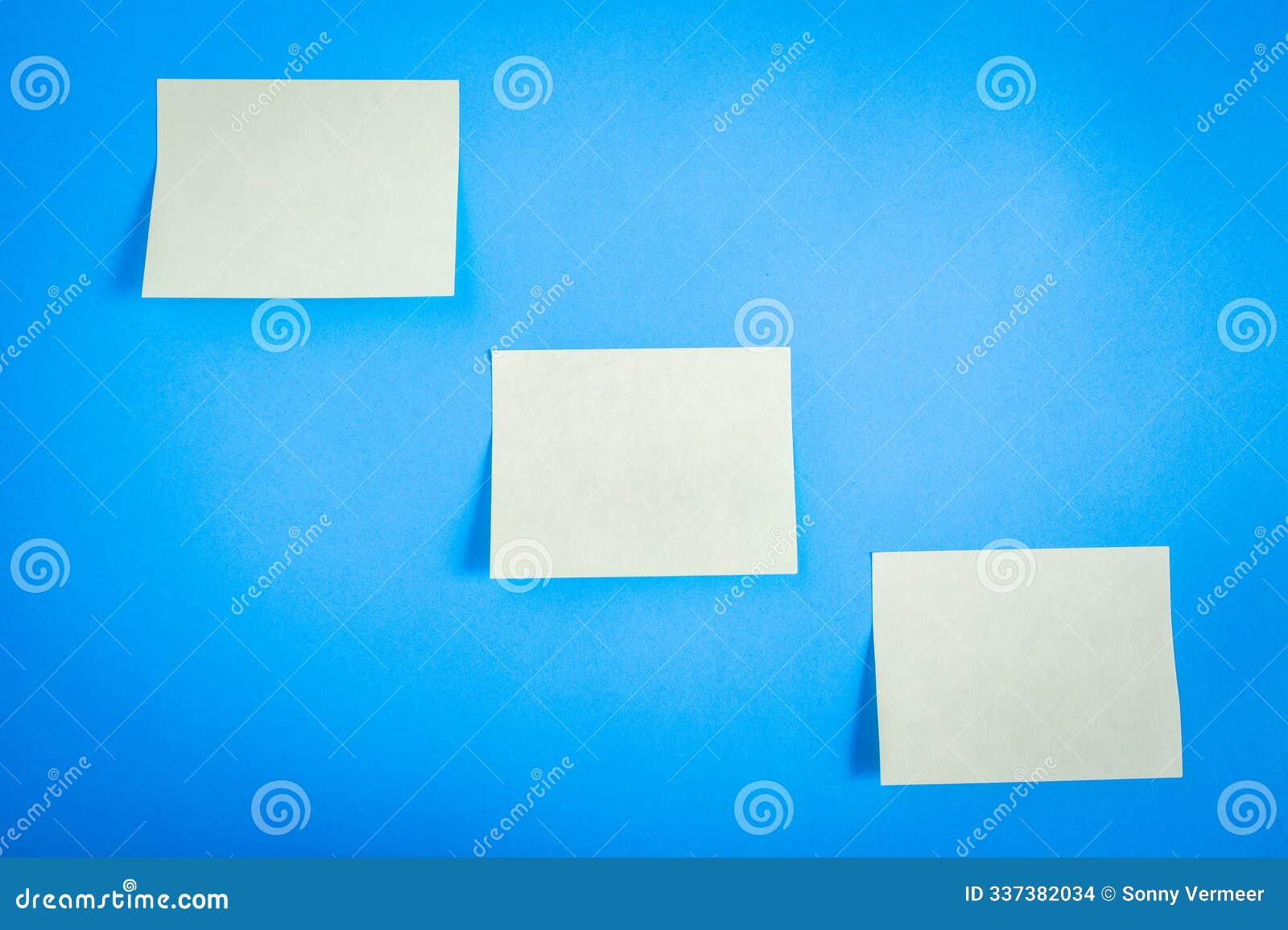 Three Empty Sticky Notes, on a Blue Background Stock Photo - Image of ...
