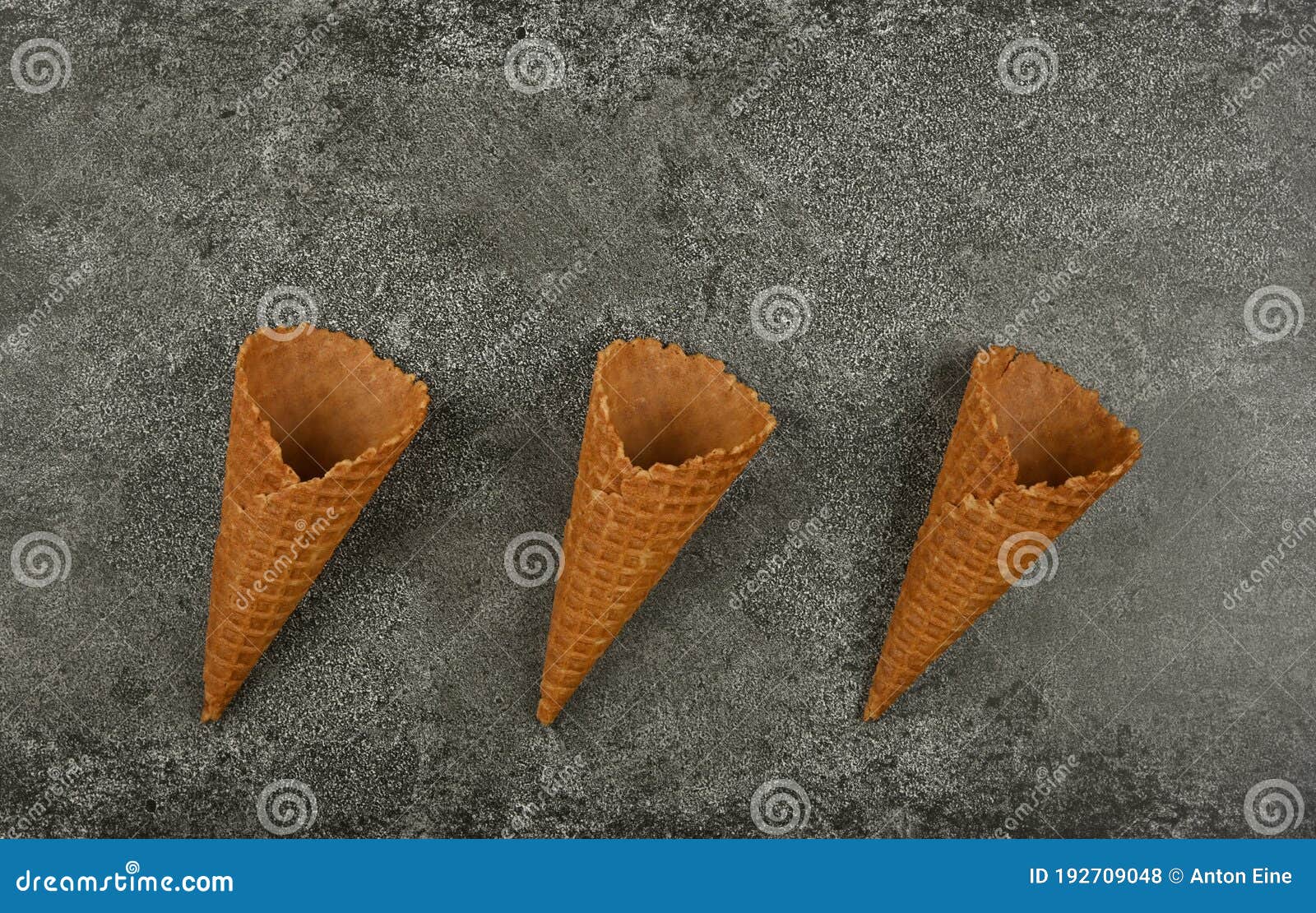 Three Empty Wafer Ice Cream Cones on Gray Table Stock Photo - Image of ...