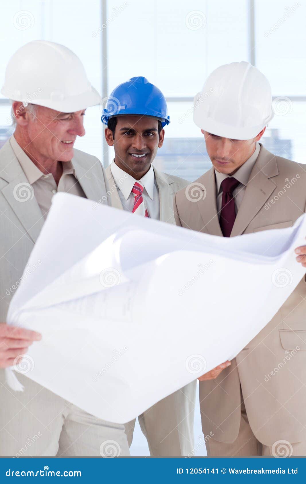 Three Engineer Co-workers Studying Plans Stock Image - Image of ...