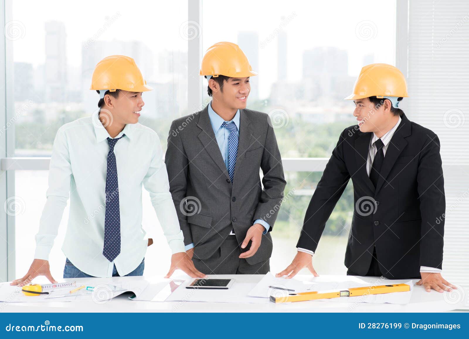Three engineers stock image. Image of discussing, inside - 28276199