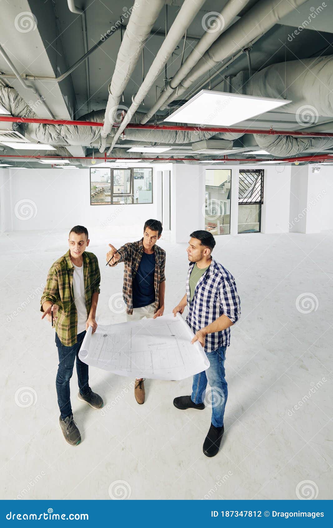 Three Engineers Brainstorming Stock Photo - Image of business, engineer ...