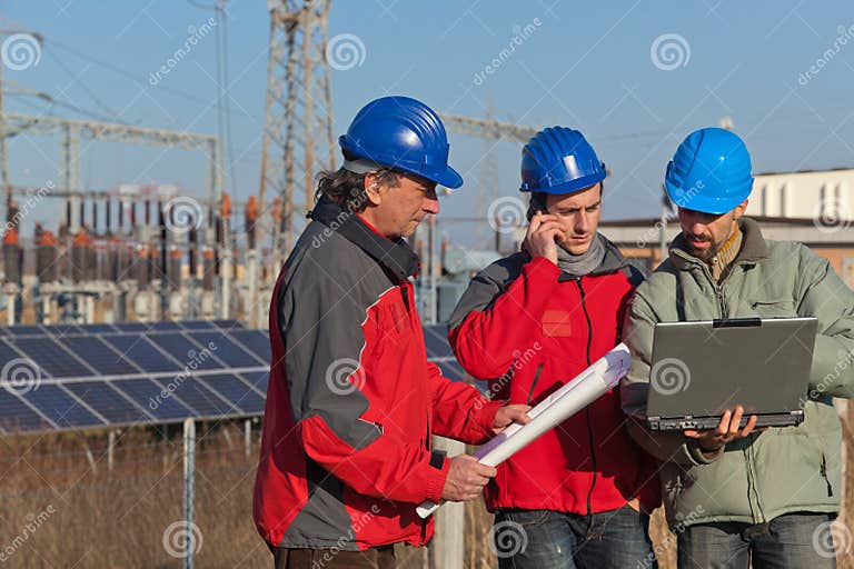 Three Engineers at Work stock photo. Image of alternative - 18115138