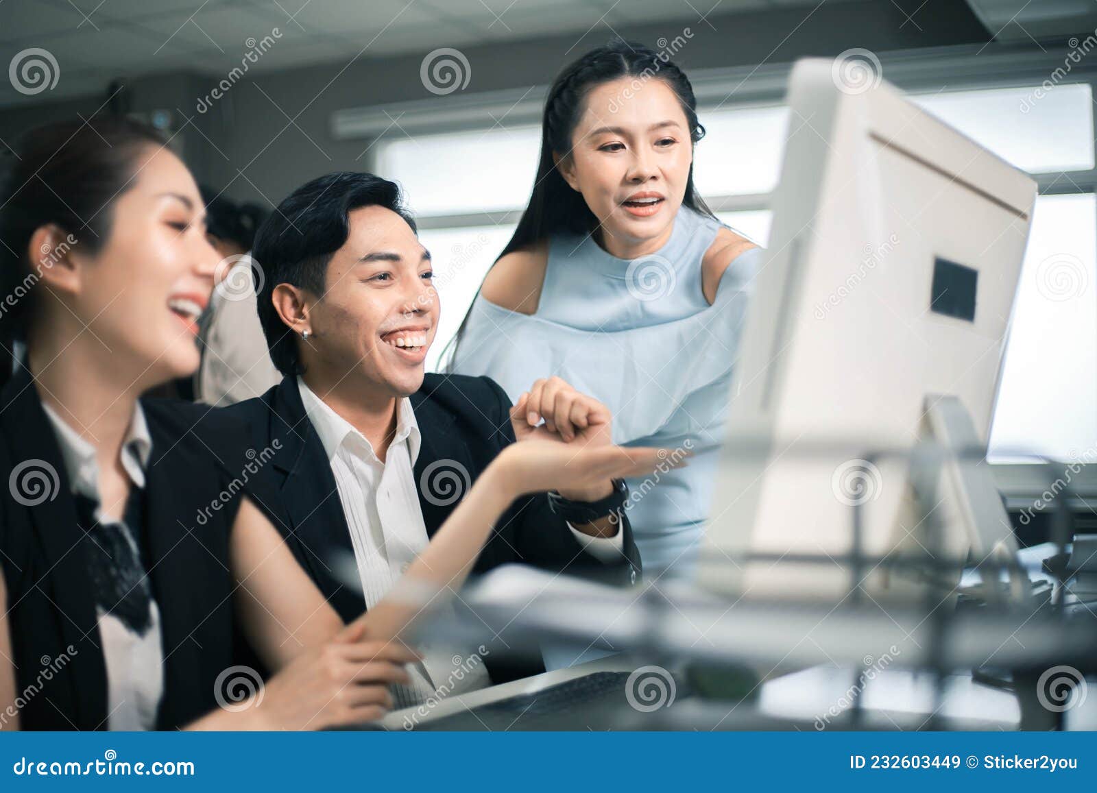 Three Excited Employees Reading Good News on Line in a Computer Desktop ...