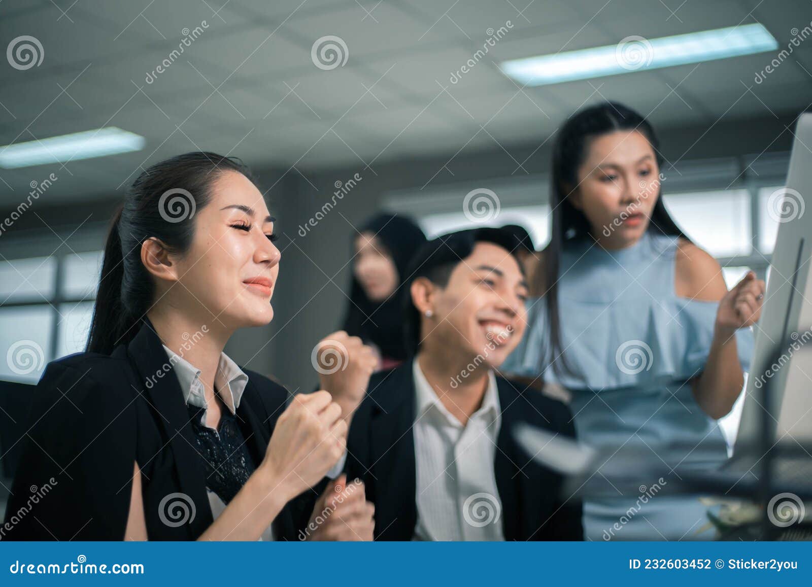 Three Excited Employees Reading Good News on Line in a Computer Desktop ...