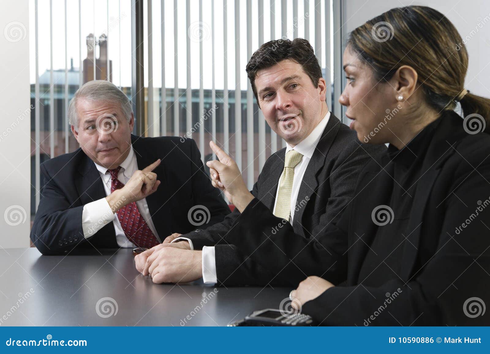Three Executives in Discussion. Stock Photo - Image of businessman ...