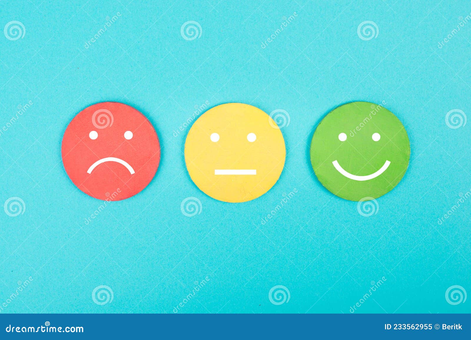Three Faces, Smiling, Sad in Different Colors on a Blue Background ...