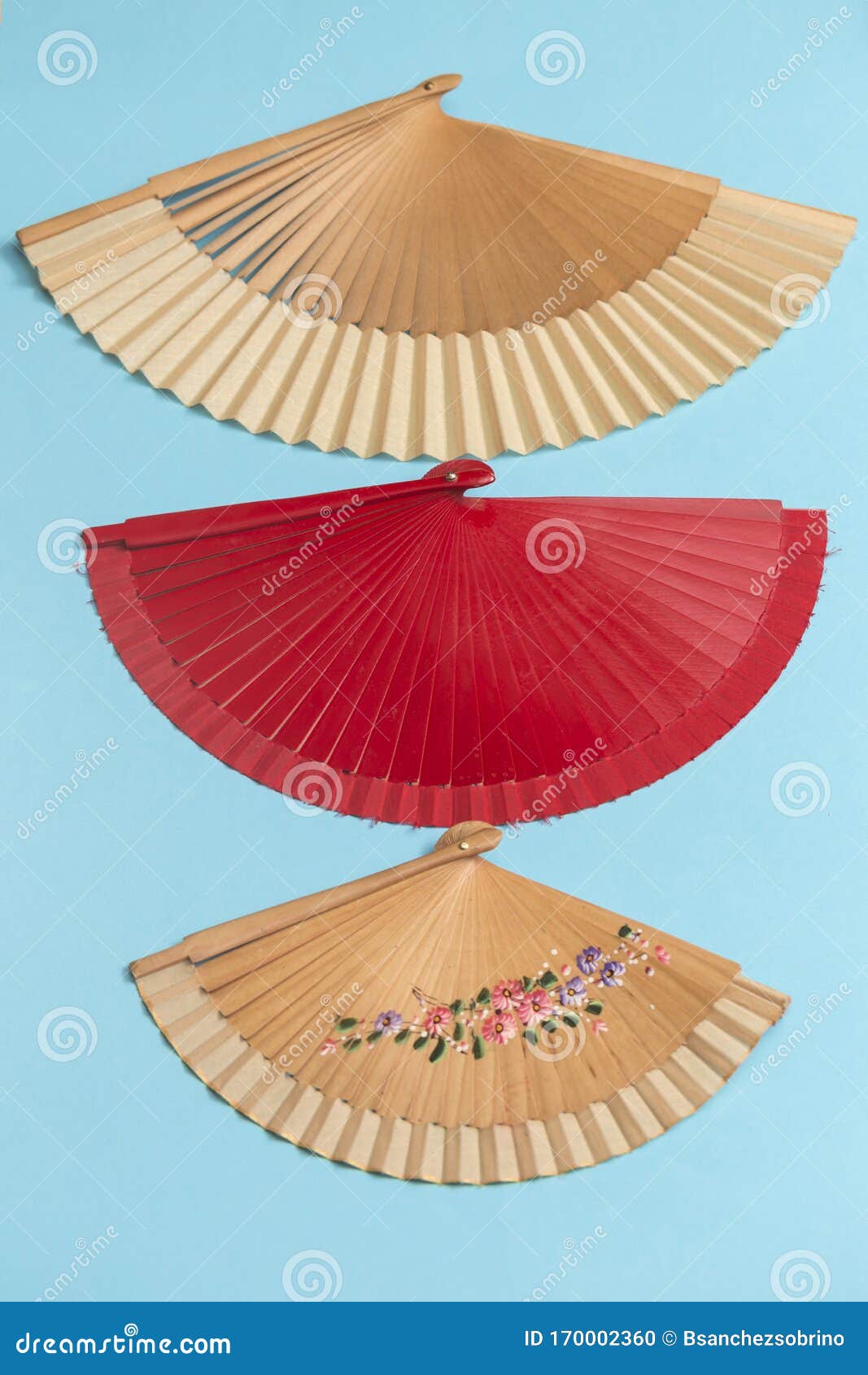 Three Fans on Blue Background Stock Photo - Image of color, flowers ...