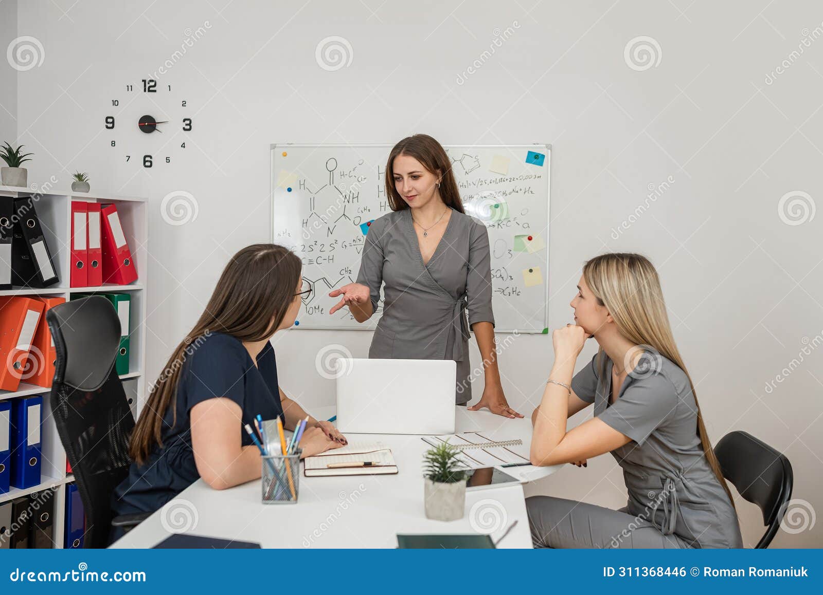 Three Female Nurses Holding Reflection Workshop in the Office with ...