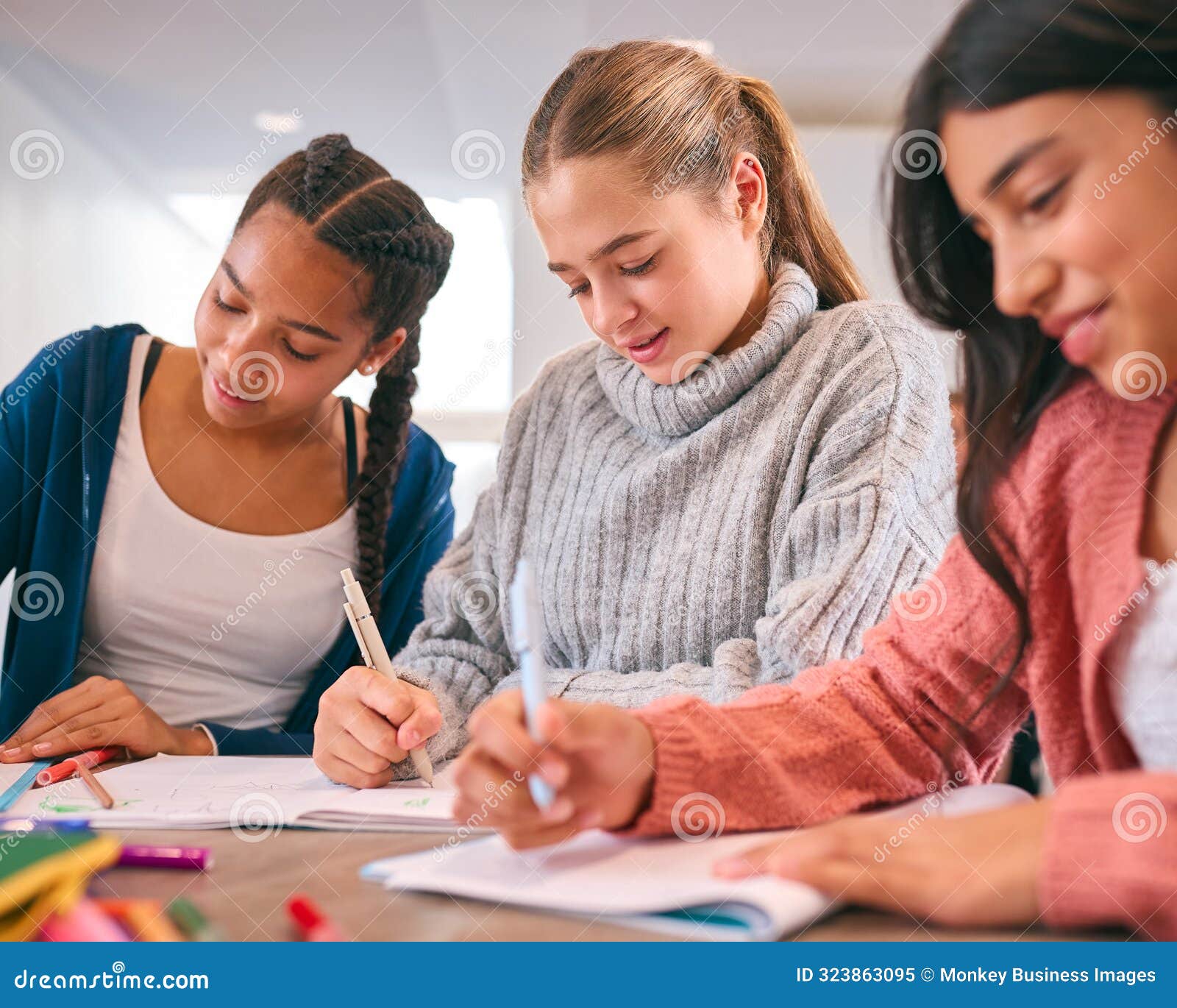Three Female Secondary or High School Students Collaborating in Study ...