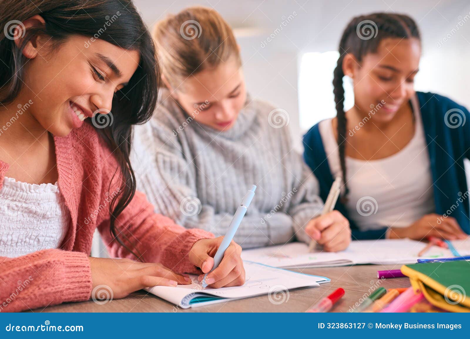 Three Female Secondary or High School Students Collaborating in Study ...