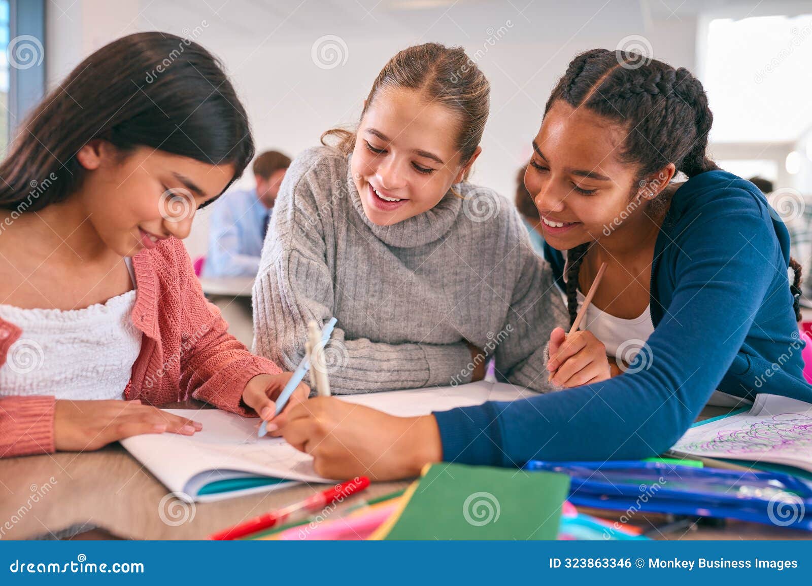 Three Female Secondary or High School Students Collaborating in Study ...