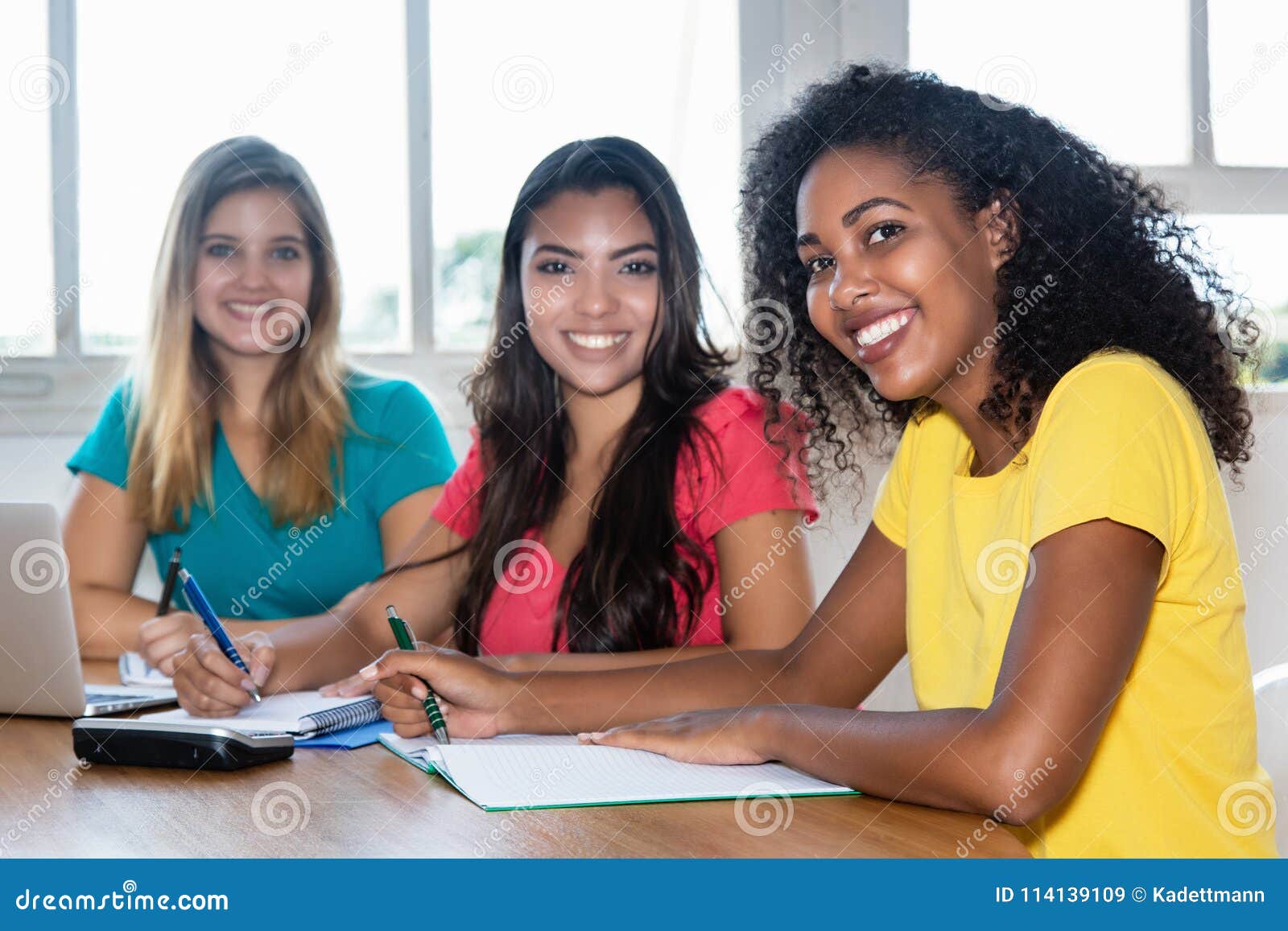 Three Female Students Learning at Classroom Stock Image - Image of ...