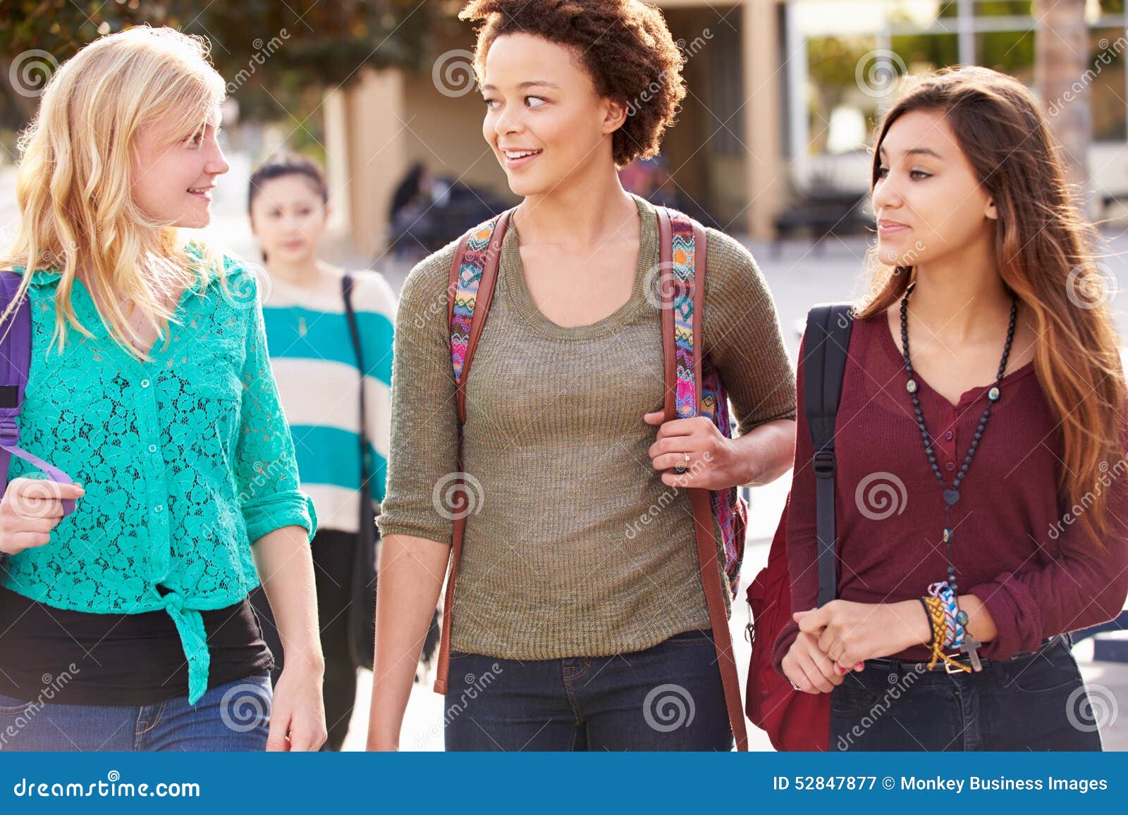 Three Female Students Walking To High School Stock Image - Image of ...