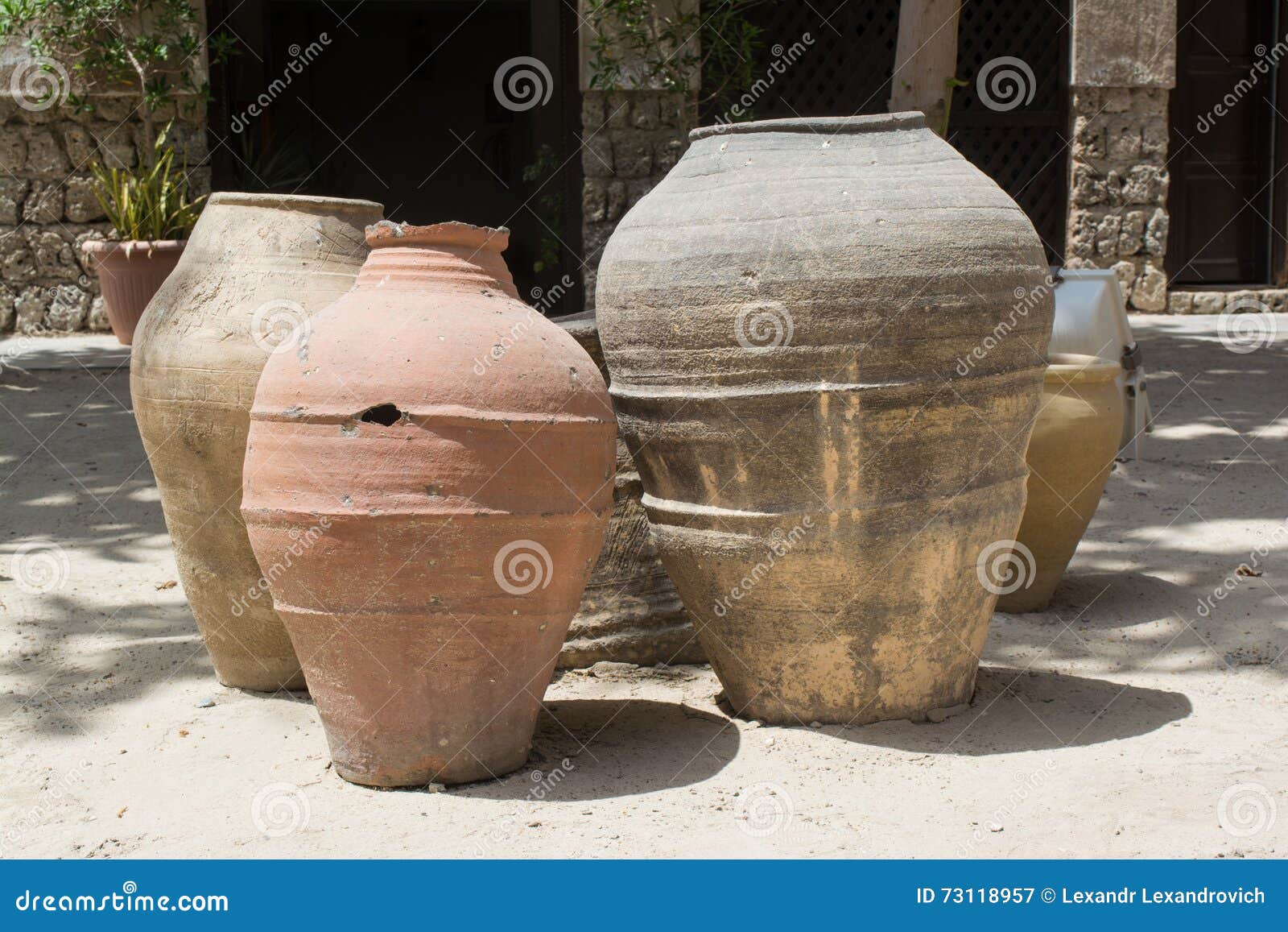 Three Fictile Old Jugs on the Sand Stock Image - Image of crockery ...