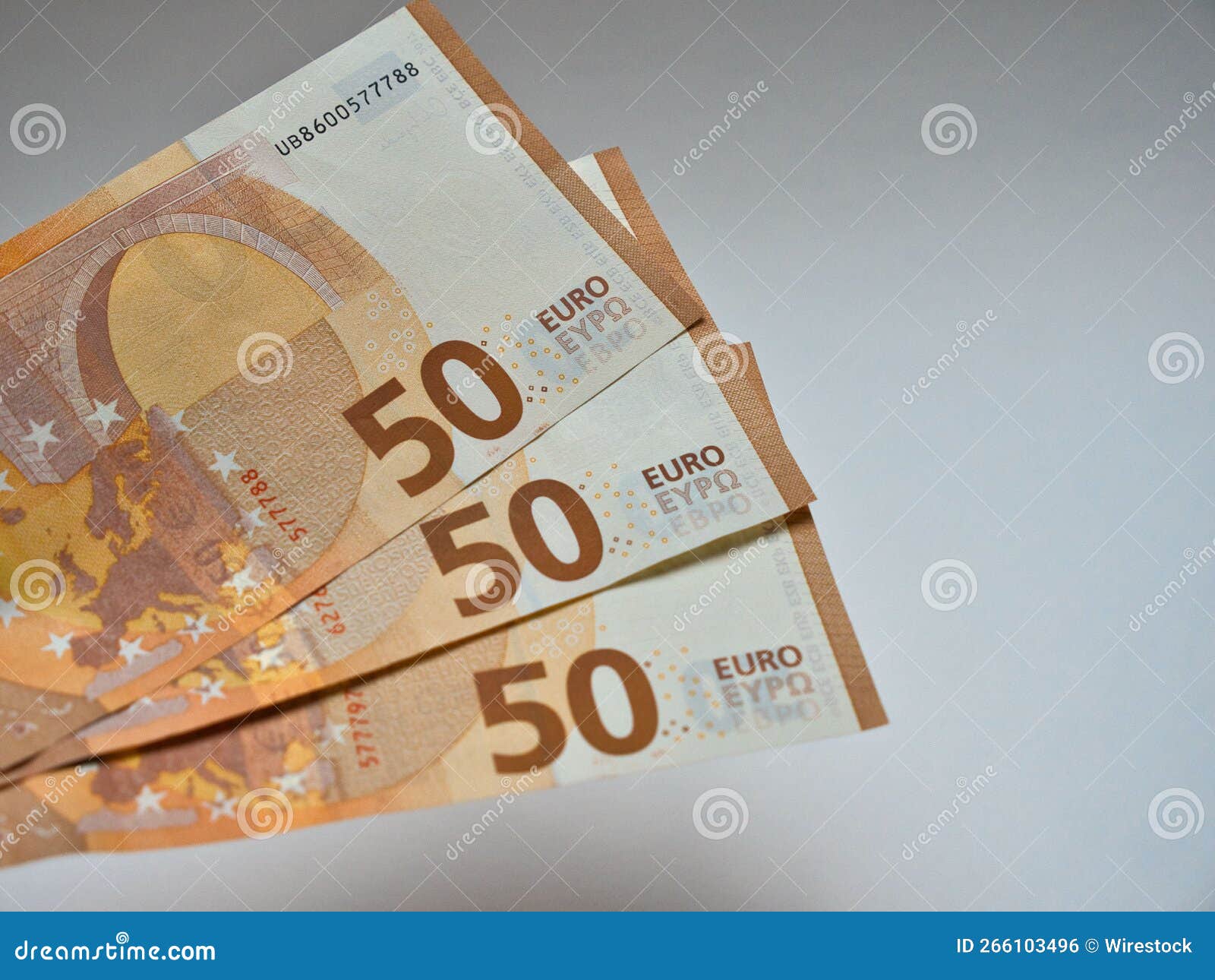 Three Fifty Euro Bills Being Held Against a White Background Stock ...