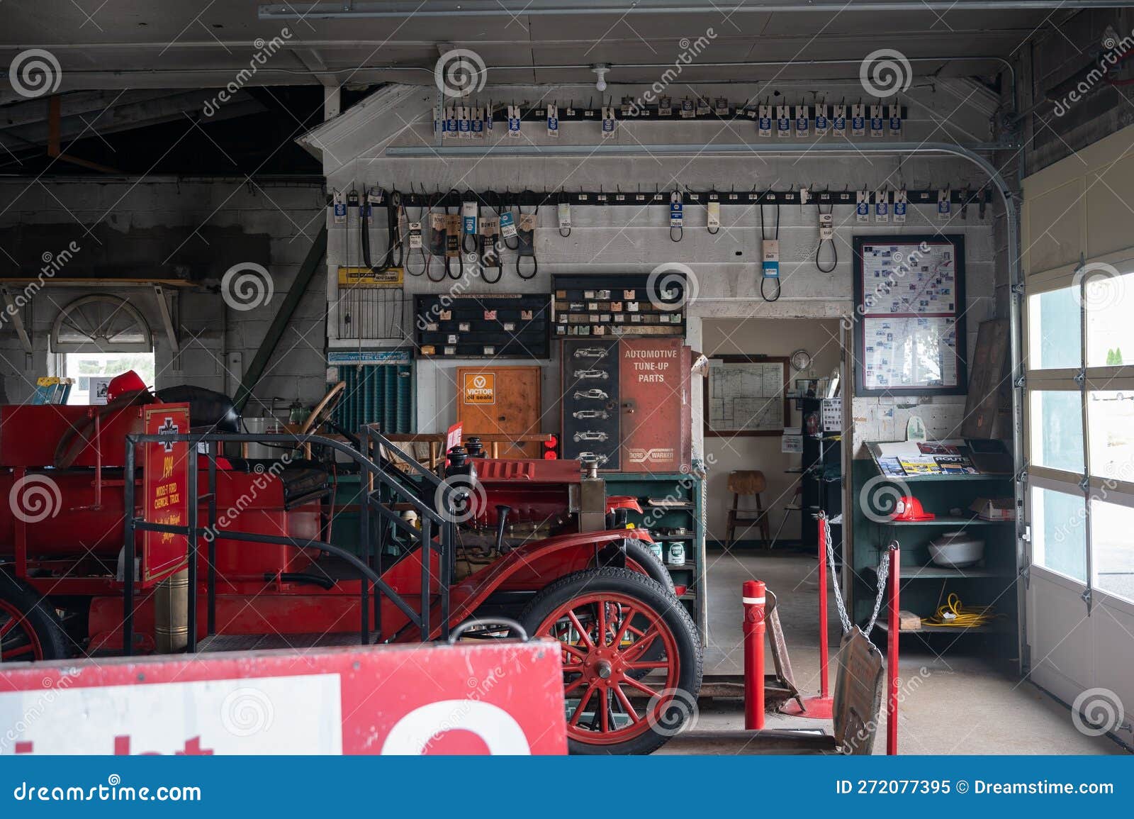 Fire Engines Sit Inside of a Garage Full of Tools and Materials ...