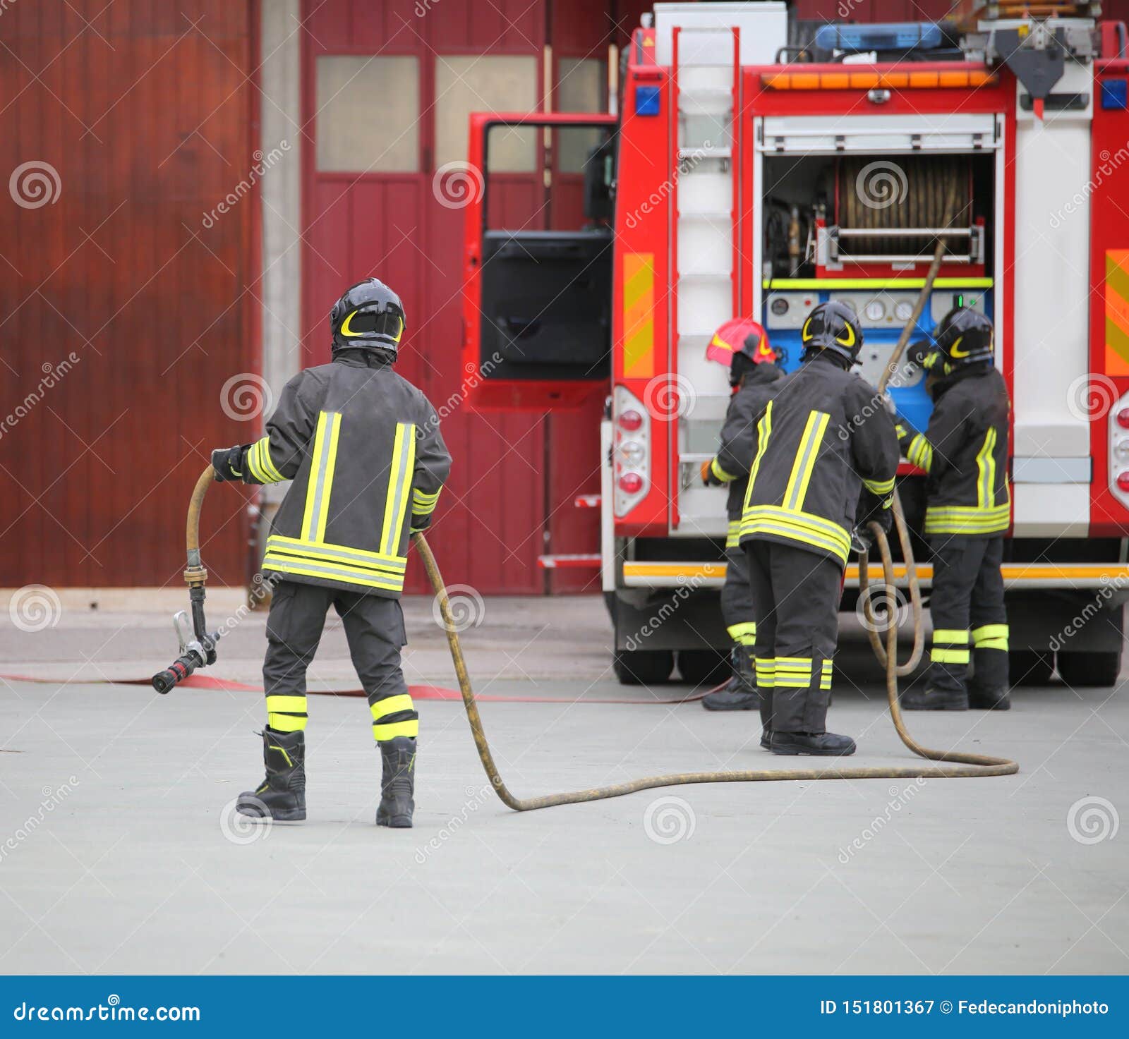 Three Firefighters On Fire Scene Walking Into A Building Royalty-Free ...