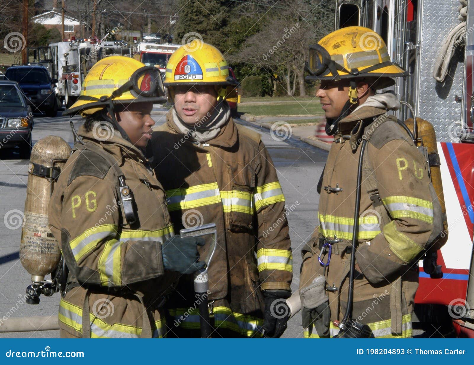 Three Firefighters Discuss Firefighting Strategy during a House Fire ...
