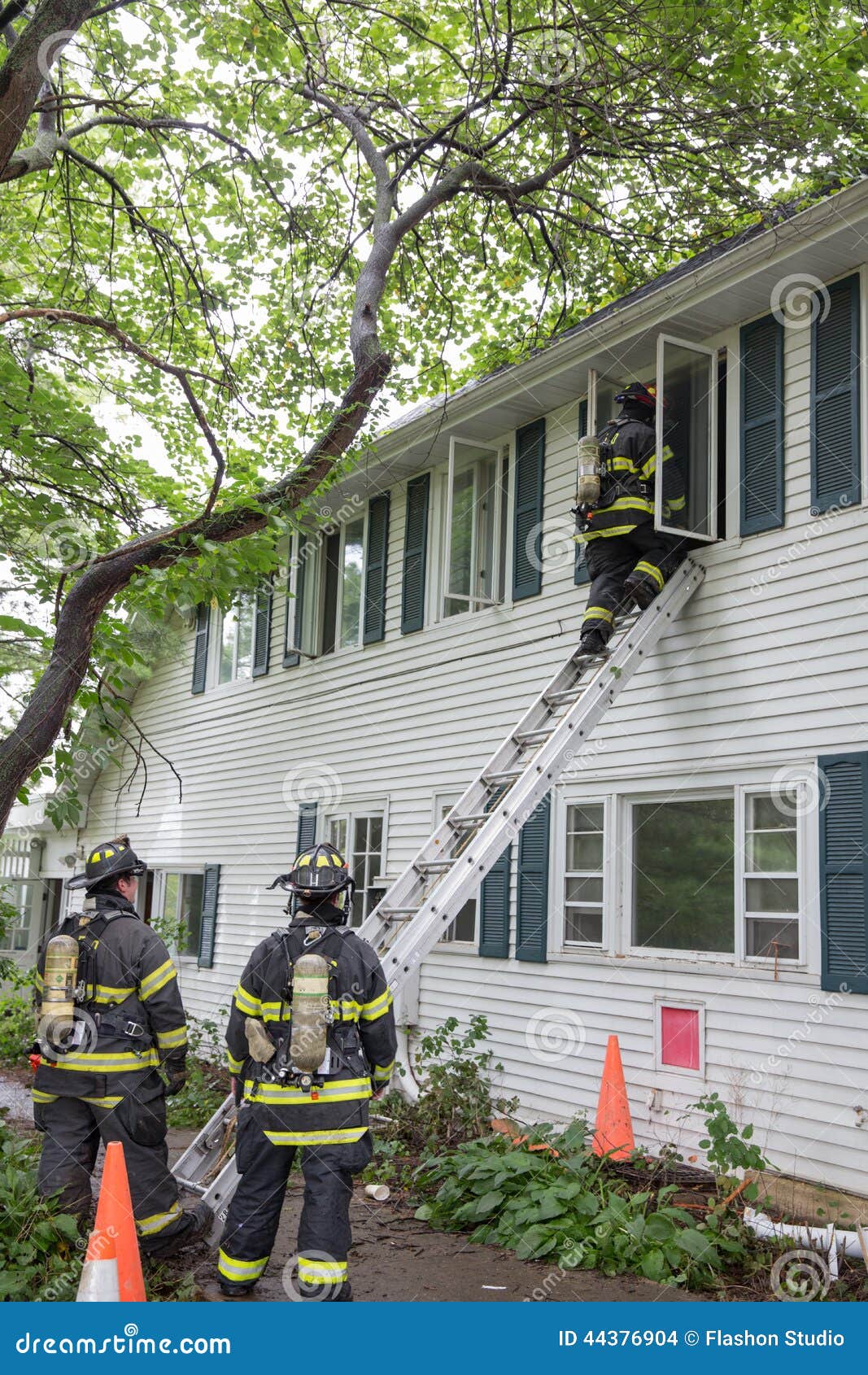 Three Firefighters on Fire Scene in Front of a Building Editorial Stock ...