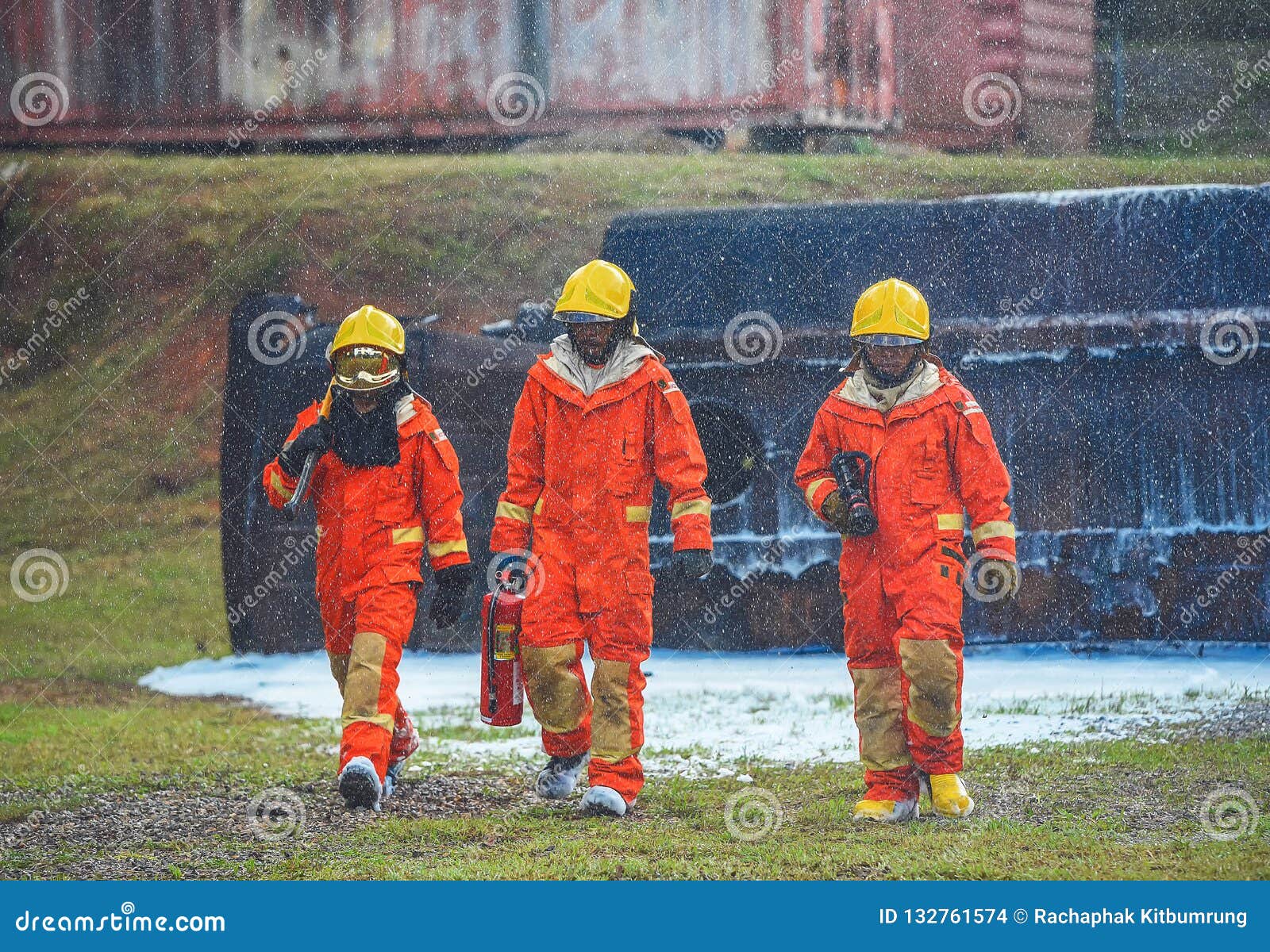 Three Firefighters On Fire Scene Walking Into A Building Royalty-Free ...