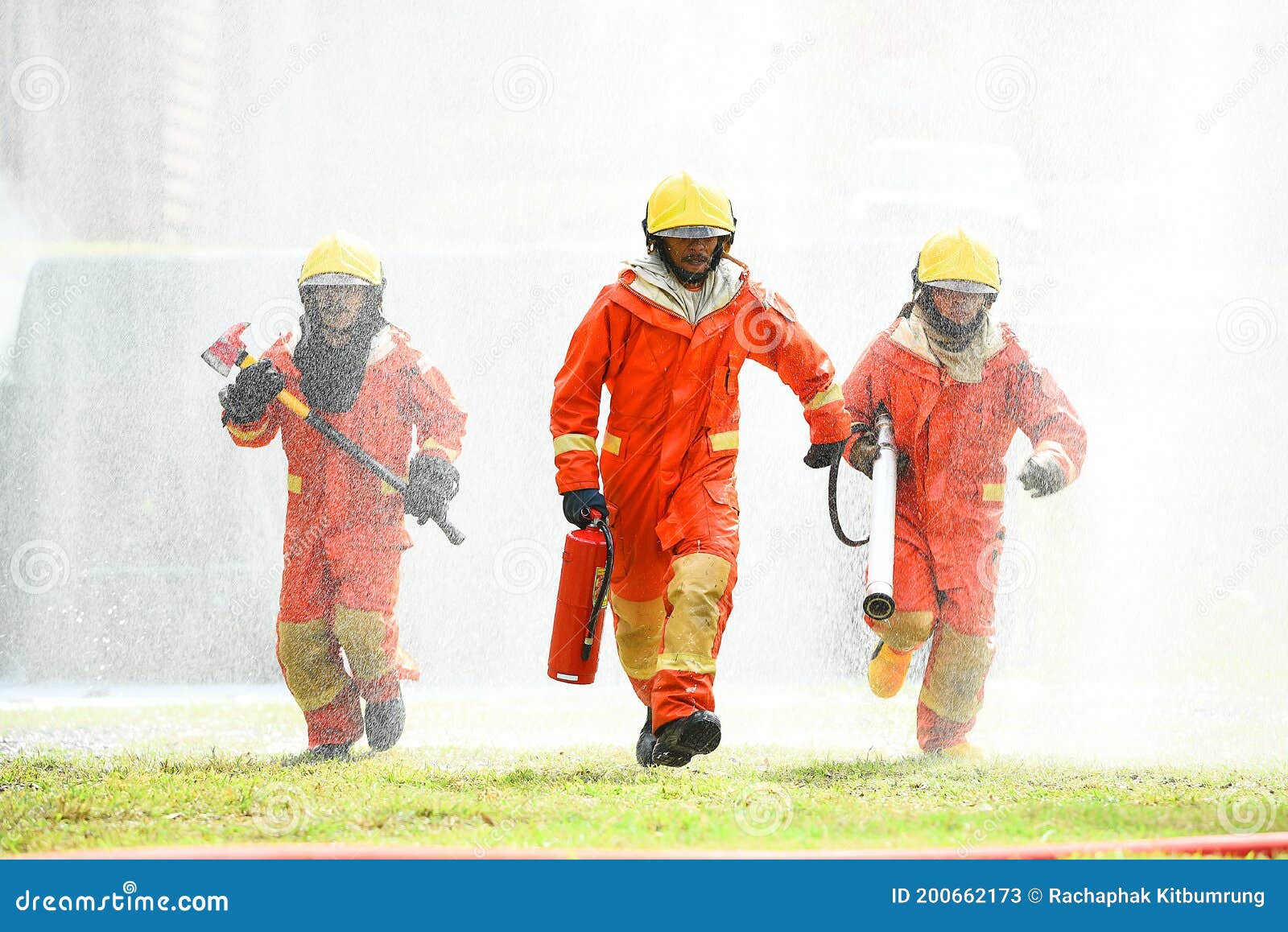 Three Firefighters On Fire Scene Walking Into A Building Royalty-Free ...