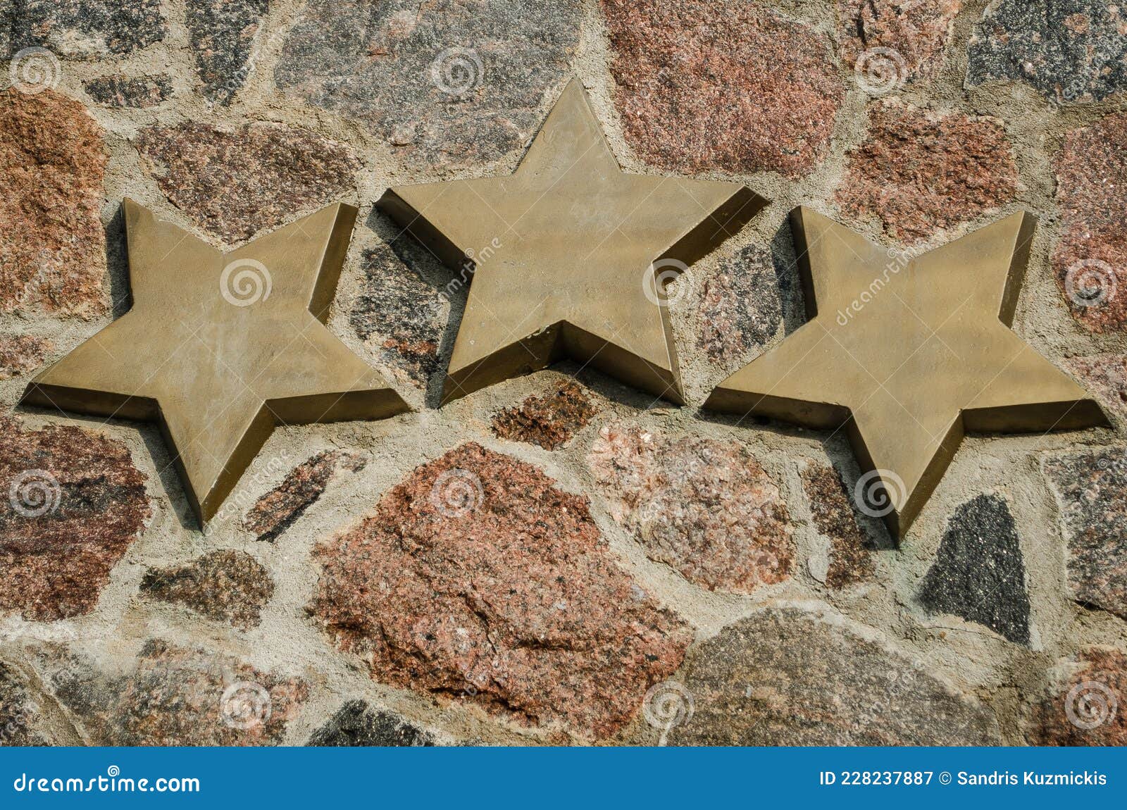 Three Five-pointed Metal Stars are Embedded in a Stone Wall Stock Image ...