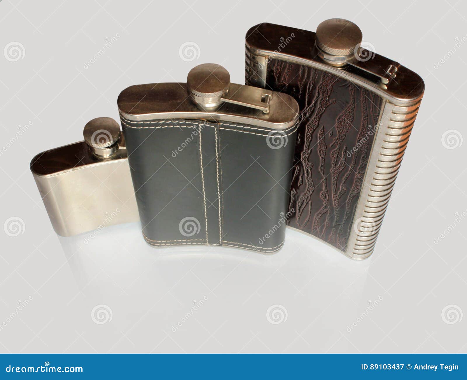 Three Flat Flask for Alcohol Isolated on a Gray Background Stock Image ...