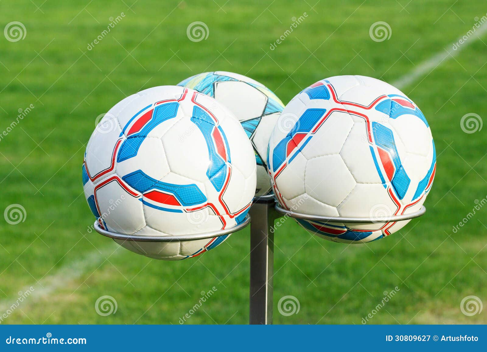 Three Football Bals on Holders Stock Image - Image of lawn, play: 30809627