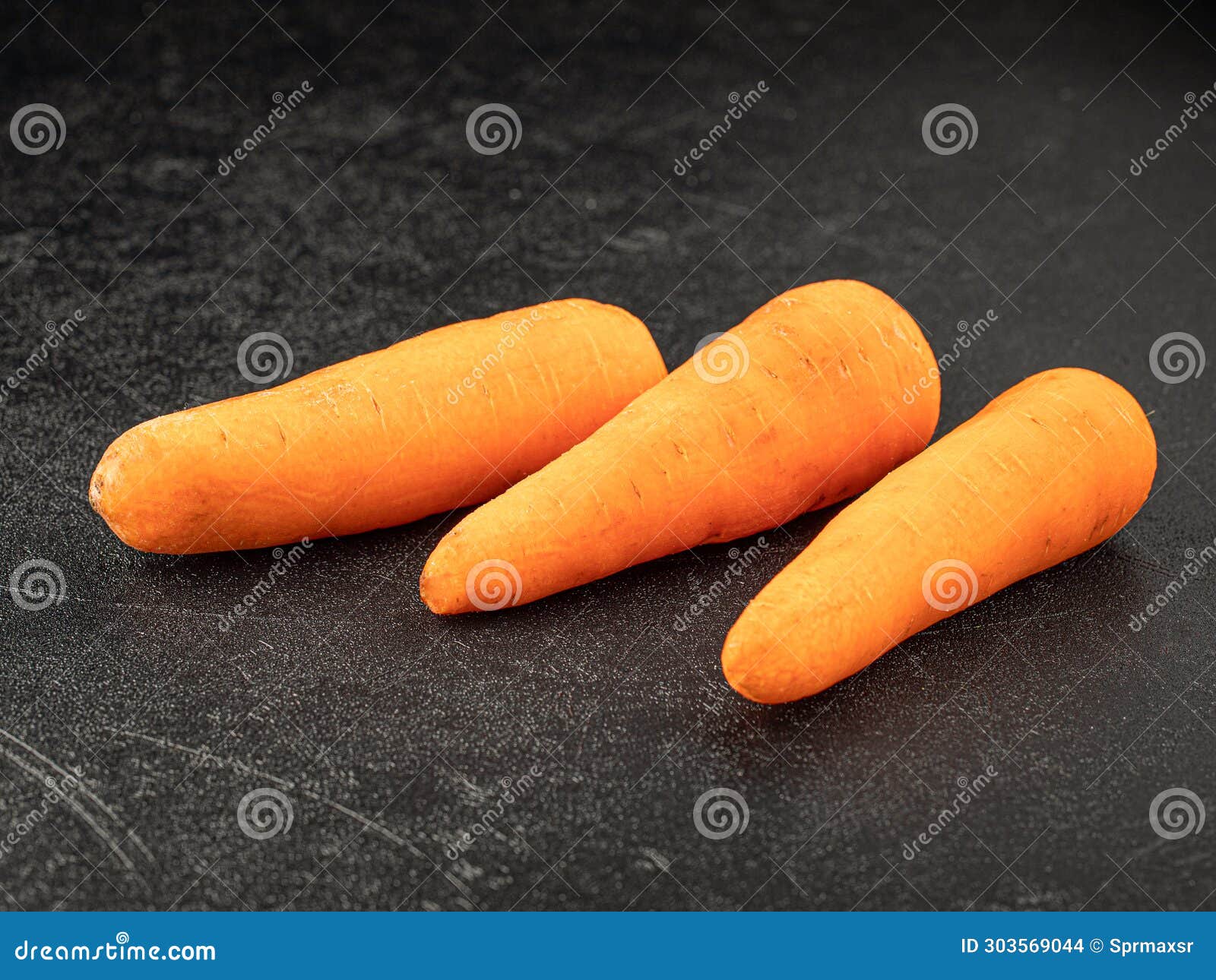 Three Fresh Carrots on Grey Stock Photo - Image of gastronomy ...