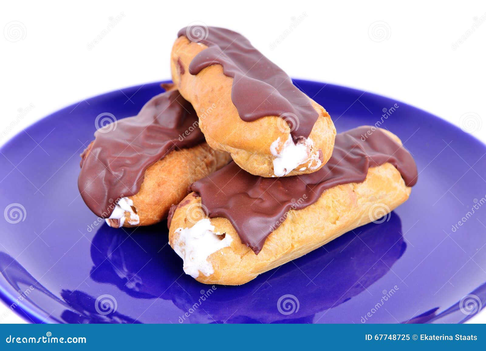 Three Fresh Eclairs on Blue Plate Stock Image - Image of custard ...