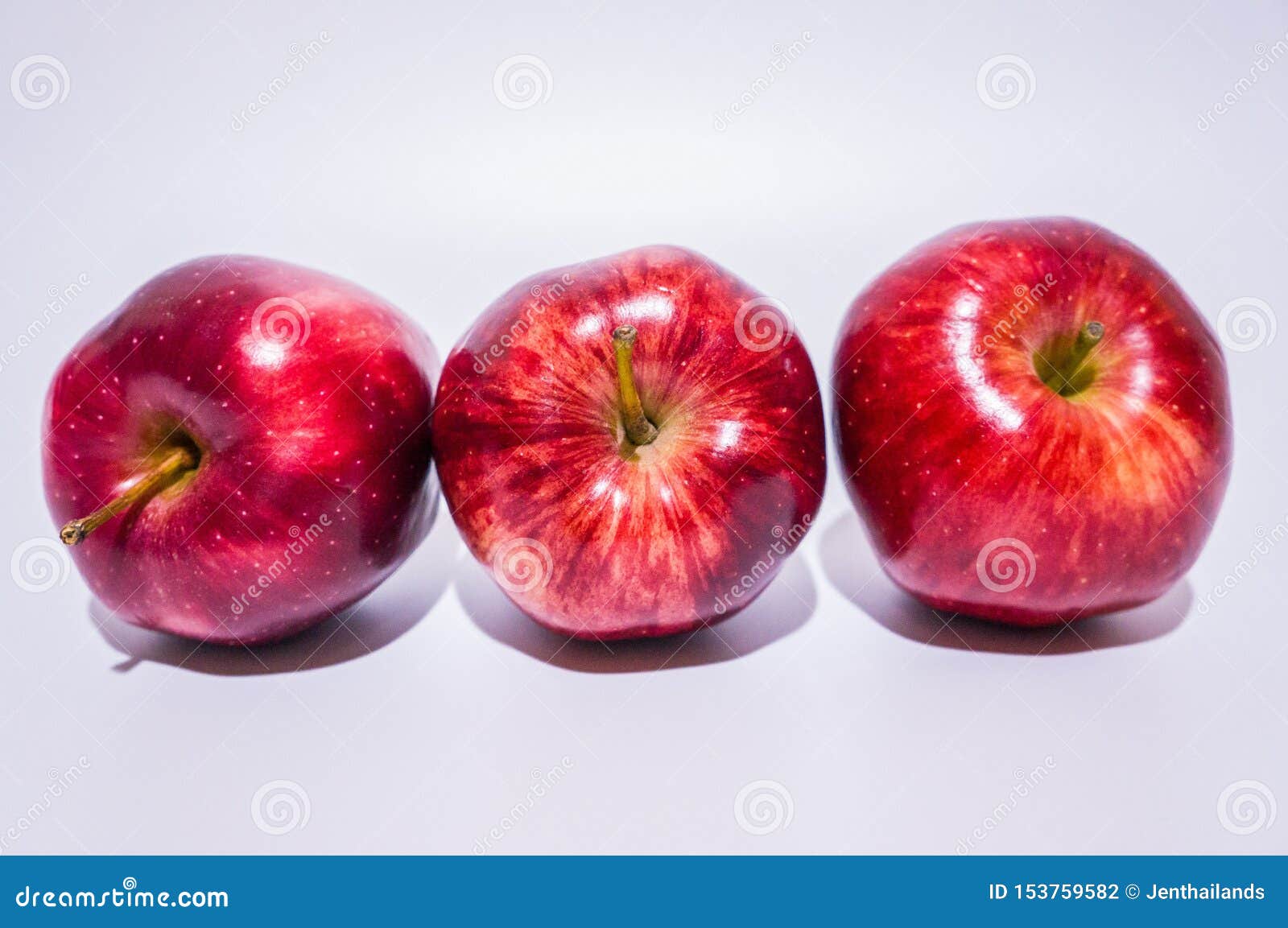 Three fresh red apples stock photo. Image of croquer - 153759582