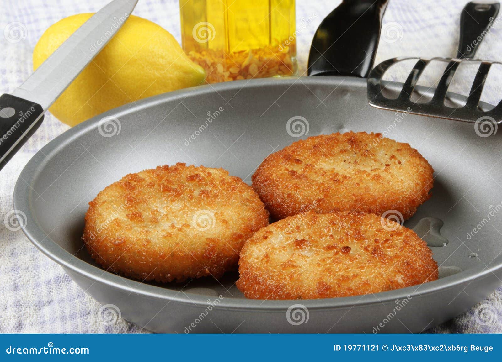 Three Fried Fish Cakes in a Pan Stock Image - Image of cake, silver ...