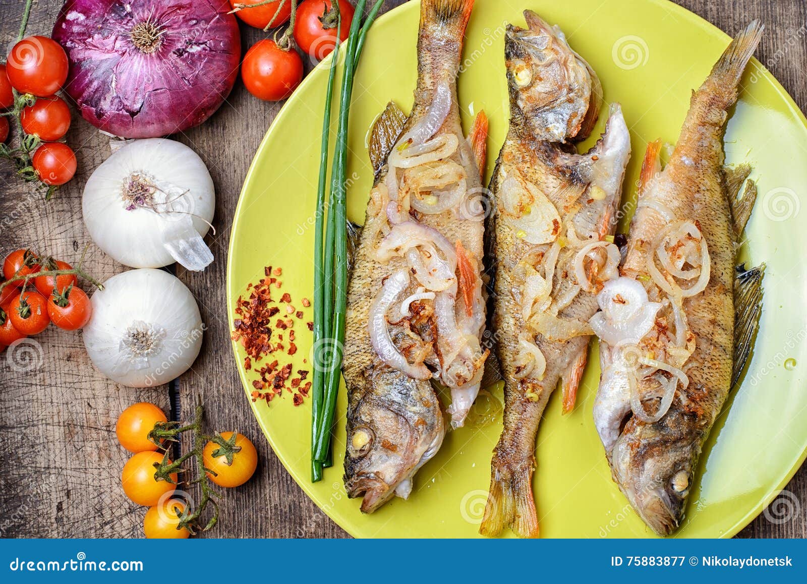 Three fried perch stock image. Image of tasty, tomato - 75883877