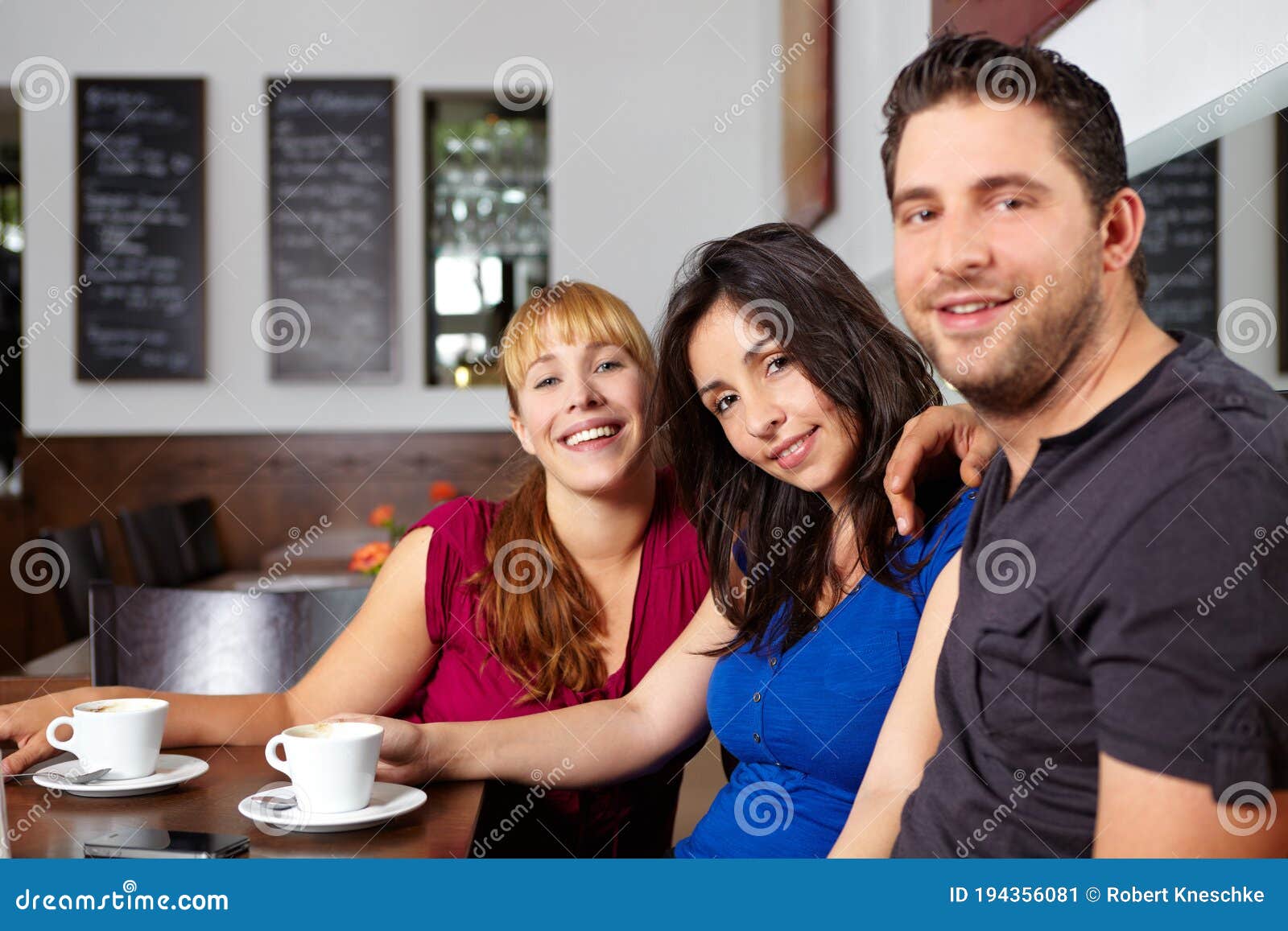 Three friends in the cafe stock image. Image of cafe - 194356081