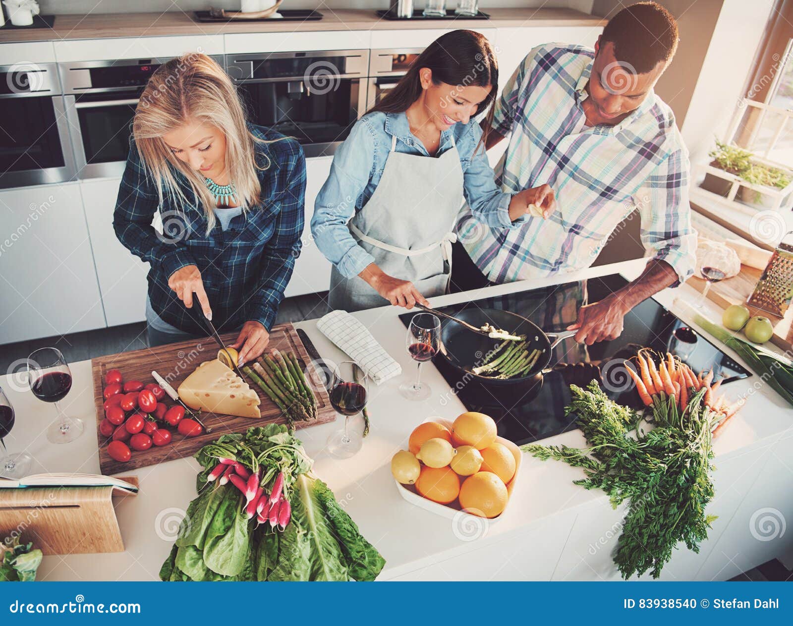 Three Friends Cooking at Kitchen Stock Photo - Image of checkered ...