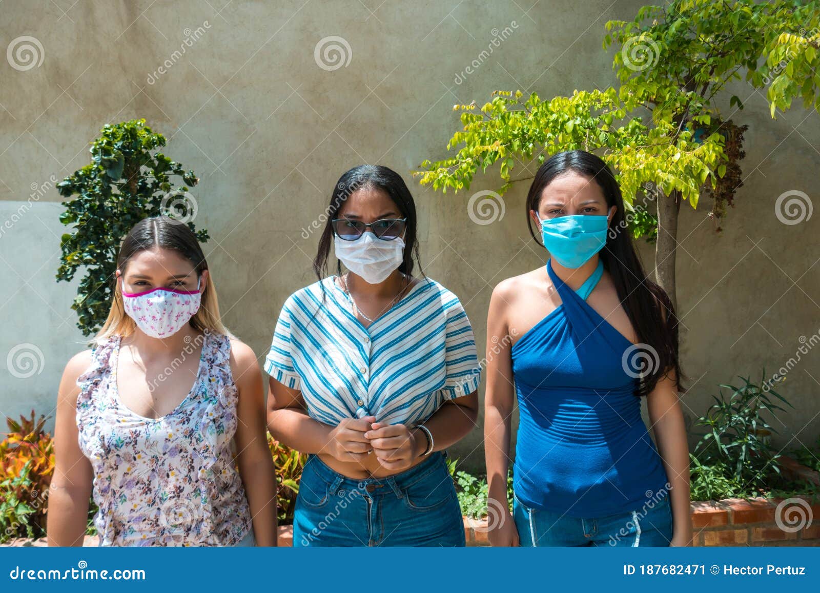 Three Friends with Face Masks in the Park. Concept of Social Distancing ...