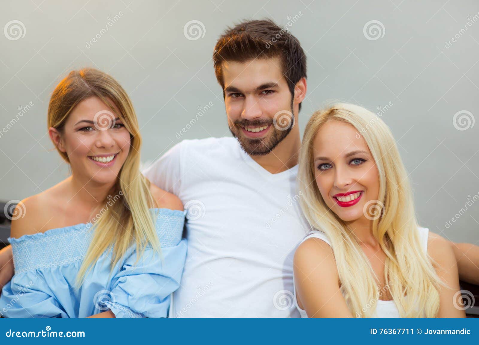 Three friends having fun stock image. Image of bench - 76367711